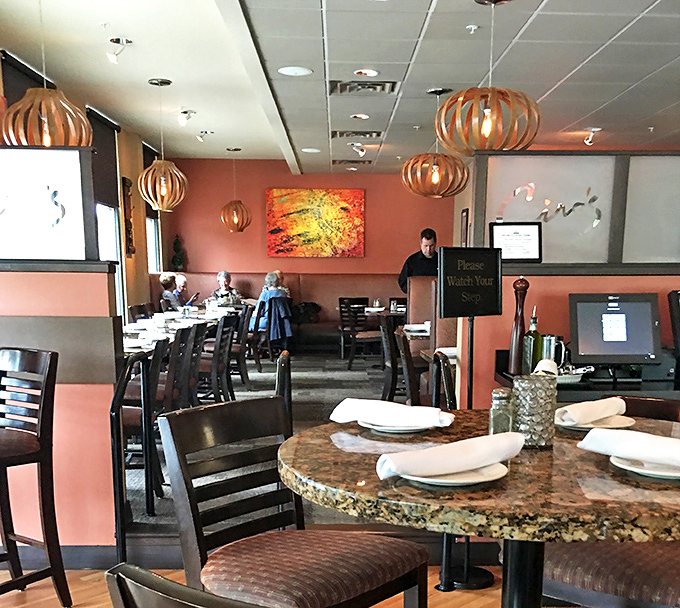 Distinctive pendant lighting casts a warm glow over tables set for memorable meals and conversations that linger longer than dessert.