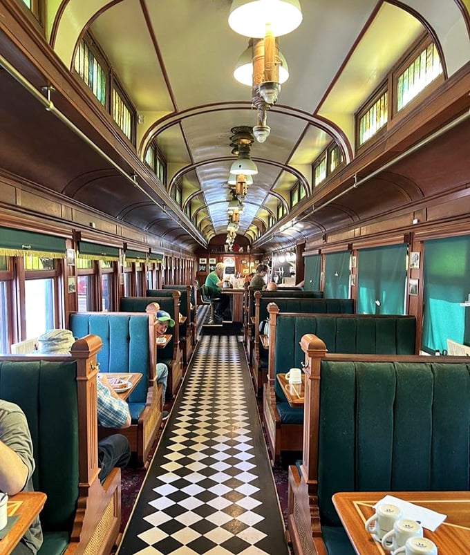 The booth seating and checkered floor create the quintessential diner experience&mdash;like stepping into an Edward Hopper painting where the coffee is always fresh.