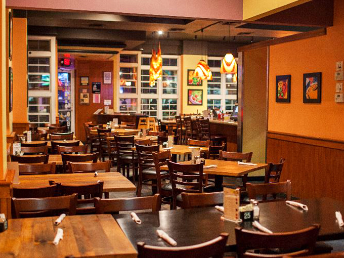 Warm wood tones and strategically placed lighting create an atmosphere that says "stay awhile" without having to say a word.