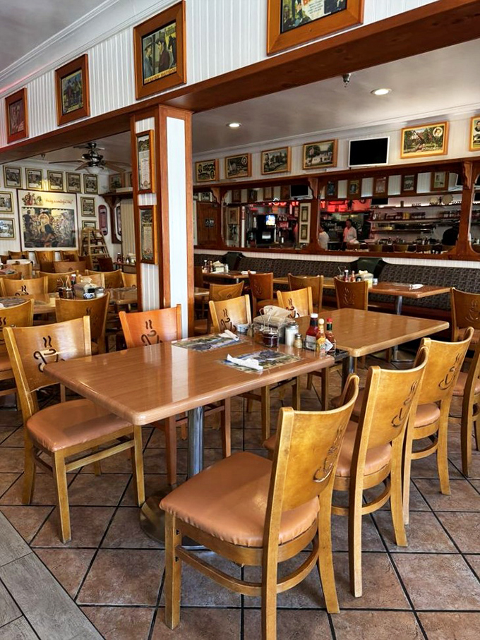 Wooden chairs engraved with coffee cup designs and warm lighting create the perfect backdrop for morning conversations and island-time dining.