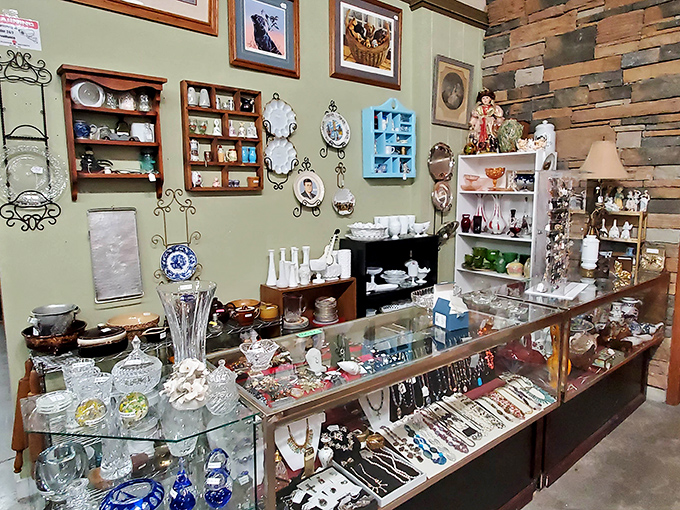 The jewelry counter gleams with yesterday's glamour. Vintage brooches and necklaces waiting to complete outfits not yet imagined.