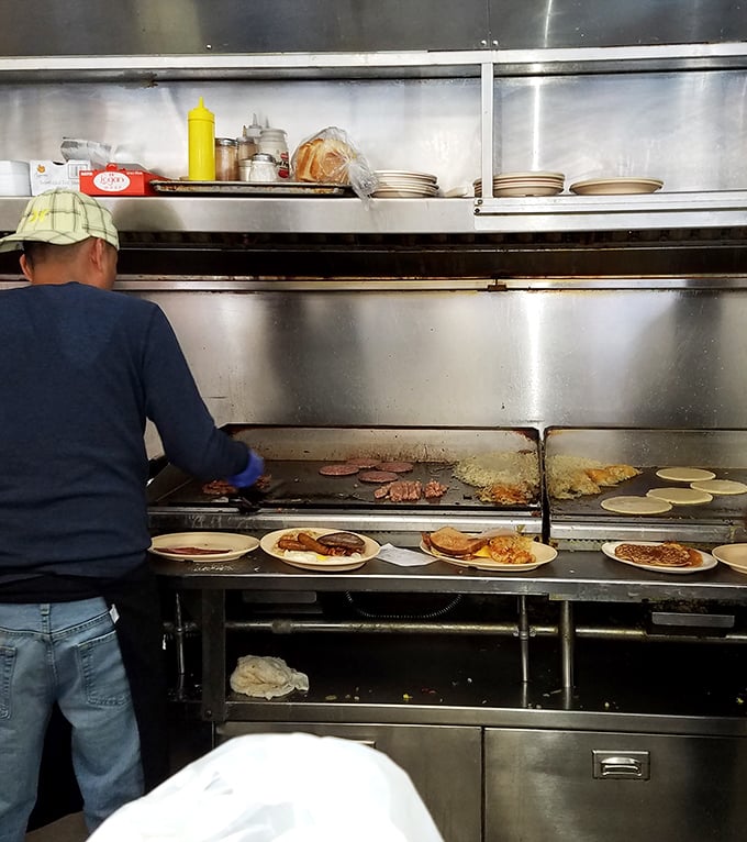 The sacred space where breakfast alchemy happens. That flat-top grill has seen more action than a Hollywood stuntman.