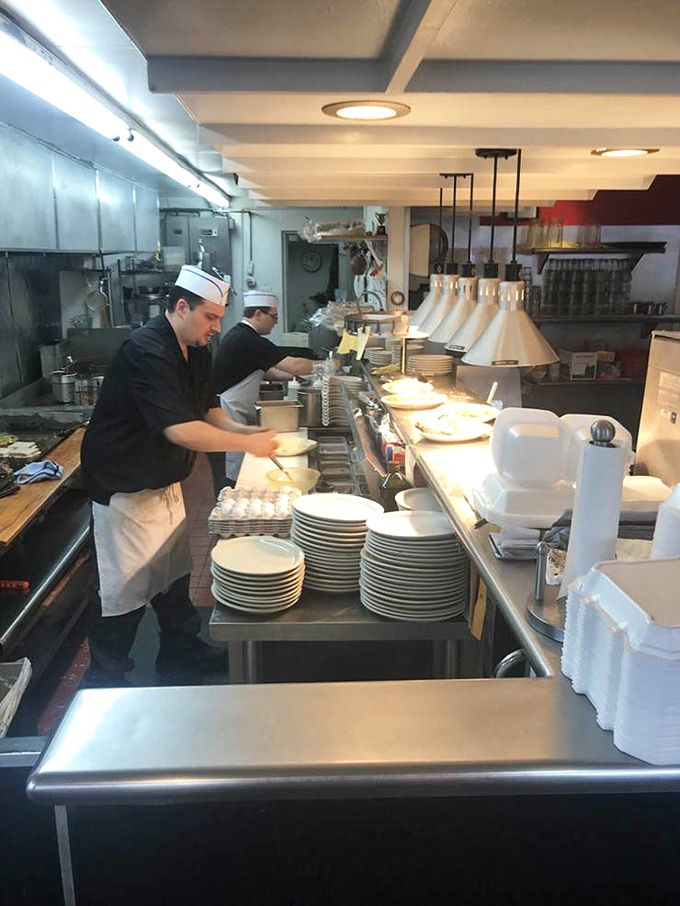 Where breakfast magic happens: no molecular gastronomy, just skilled hands that could probably flip eggs blindfolded after years of practice.