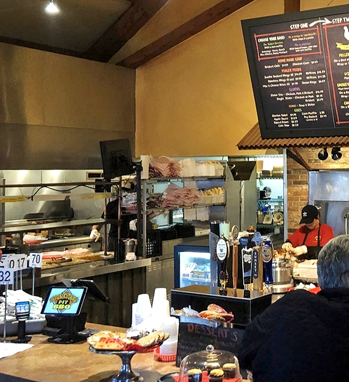 A glimpse into the kitchen reveals the alchemy where smoke, meat, and time create edible magic.