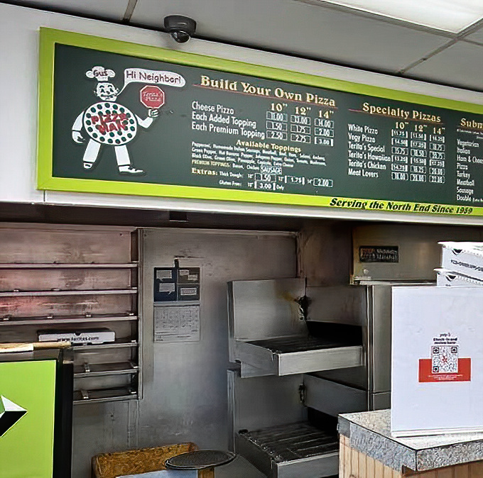 A glimpse into the kitchen reveals the workmanlike approach to pizza perfection. No theatrics, just time-tested techniques and equipment.