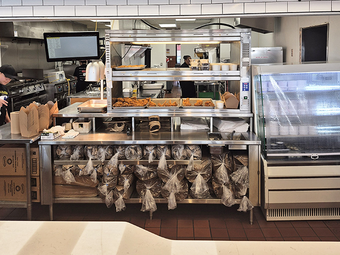 Where the magic happens. The kitchen's organized chaos reveals the care behind each crispy, golden offering that makes it to your table.