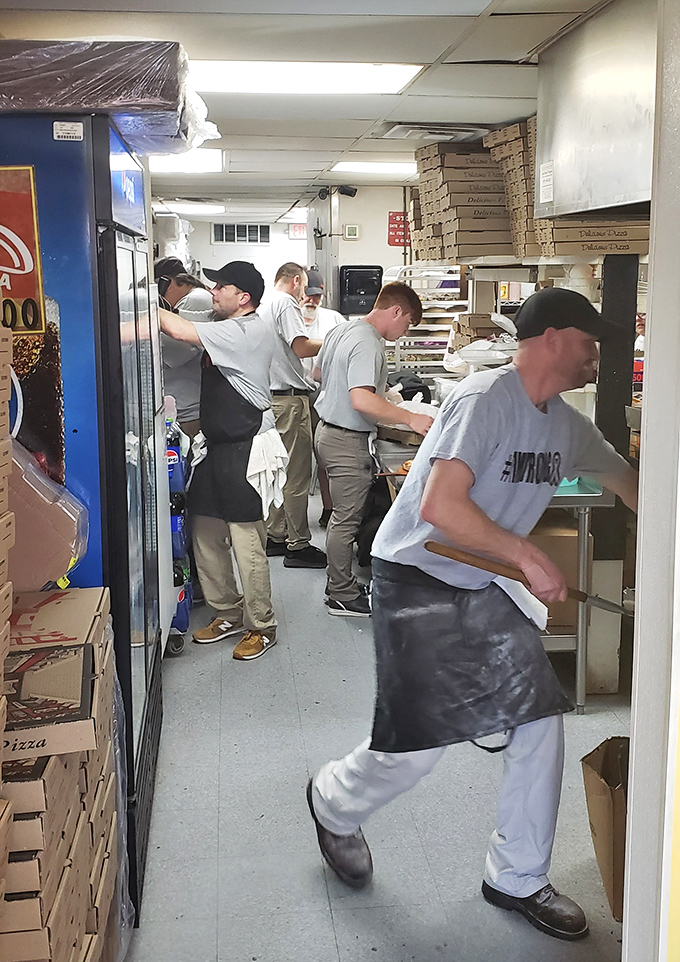 Behind-the-scenes magic where dough-spinning wizards transform simple ingredients into the comfort food that fuels beach vacations and local dinner plans alike.