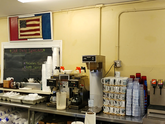 The coffee station stands ready for action, with mugs lined up like soldiers awaiting their caffeinated marching orders.