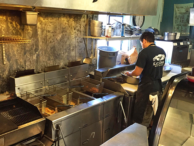 Where the magic happens: The kitchen's sizzling fryers transform fresh catches into golden masterpieces of culinary art.