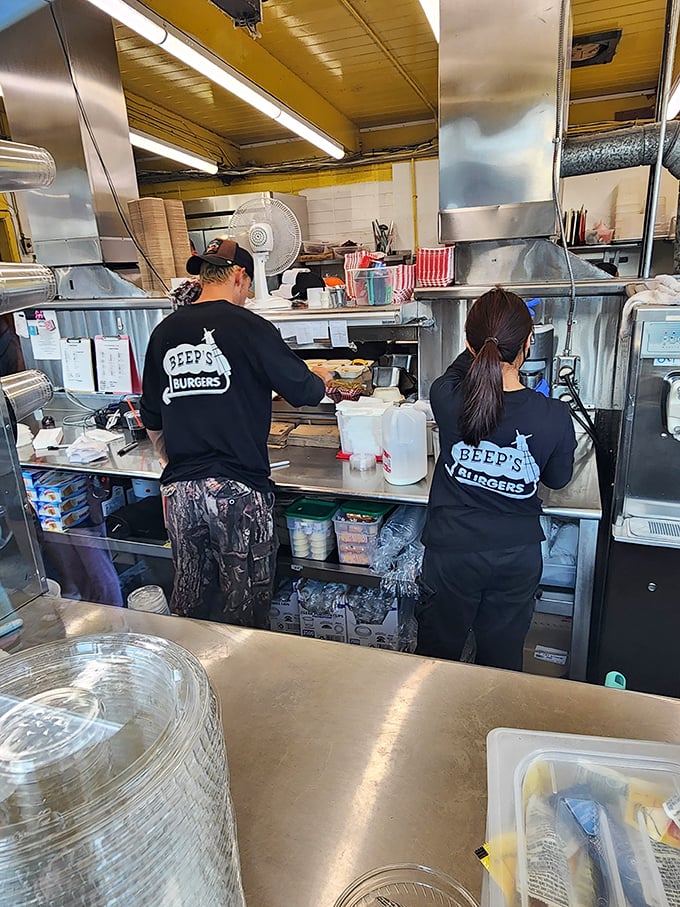 Behind the scenes, the kitchen crew moves with practiced precision, turning simple ingredients into the comfort food of collective memory.