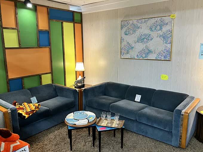 This blue sectional with stained glass backdrop isn't just mid-century modern – it's the living room set from the Brady Bunch's cooler neighbors.