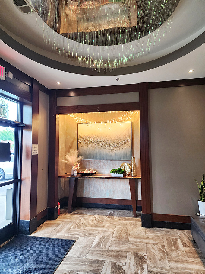 The entrance lobby's fiber optic ceiling creates a waterfall of light, welcoming hungry visitors into a space where ordinary dining expectations dissolve.