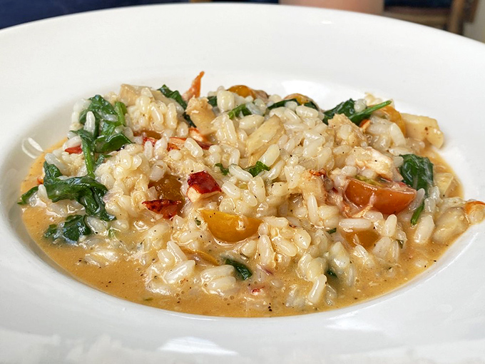 Risotto that whispers sweet nothings to your taste buds&mdash;creamy rice cradling tender morsels of lobster in each luxurious spoonful.