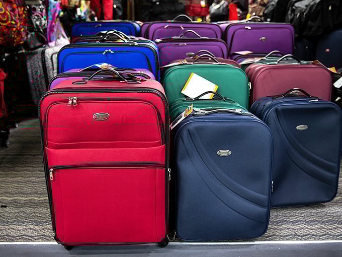 Luggage that's ready for adventure before you are. These colorful suitcases are just waiting to be filled with more flea market finds.