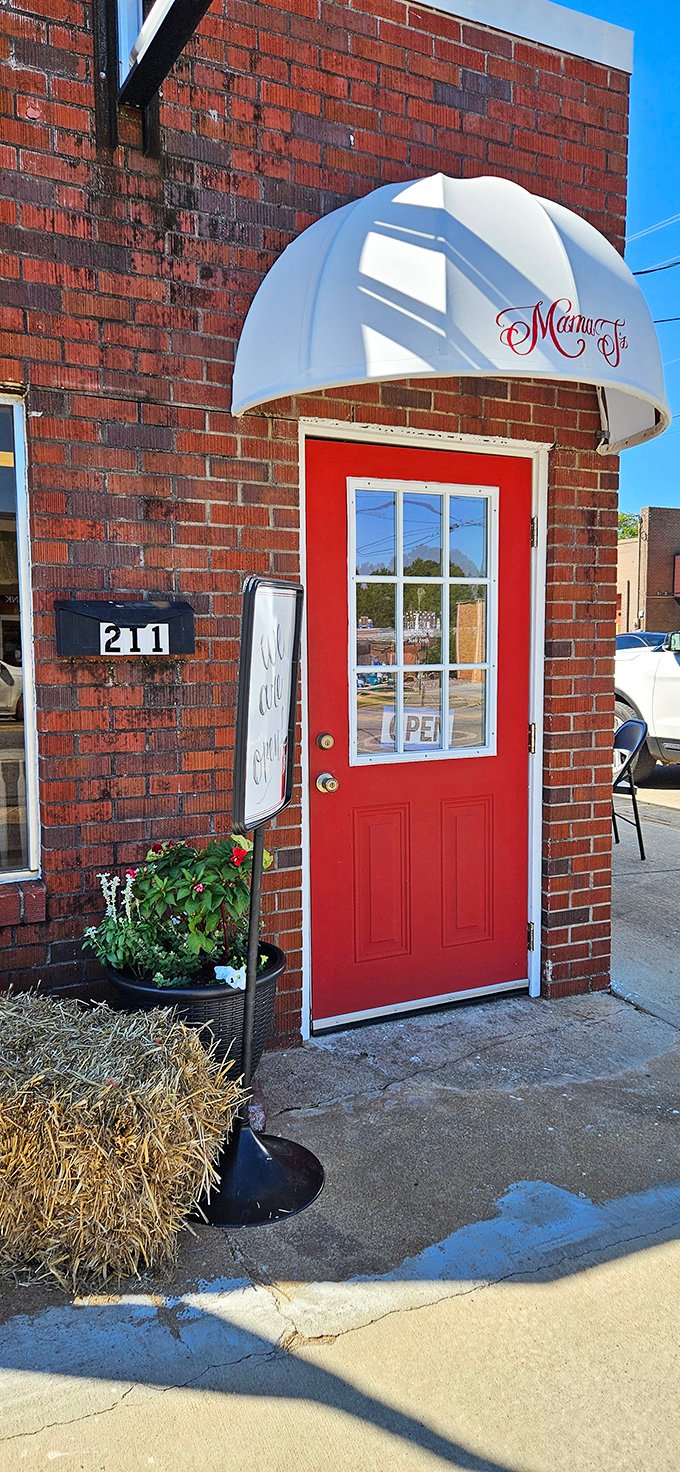 Mama T's bright red door pops against classic brick like an invitation to good times. Some of life's best flavors hide behind the simplest entrances.