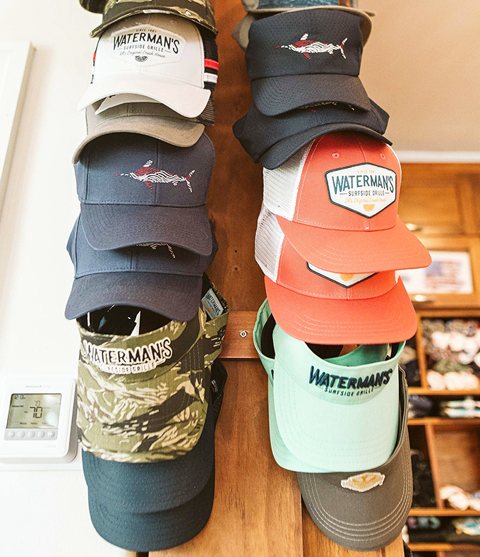 The hat wall: where loyal patrons leave with both full bellies and branded souvenirs to make their friends back home properly jealous.