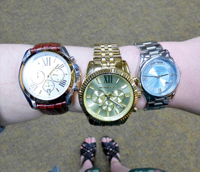 Time stands still as Michael Kors watches display their gleaming faces—luxury timepieces that won't require a second mortgage.