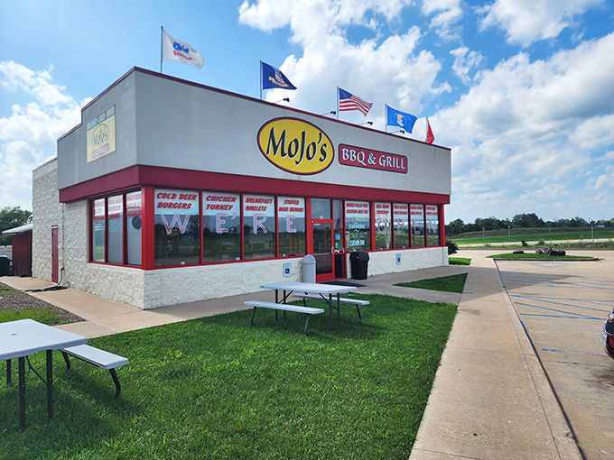 MoJo's BBQ & Grill announces itself with bold signage and multiple flags. This corner spot promises the kind of satisfying, sauce-slathered goodness that requires extra napkins and zero pretension.