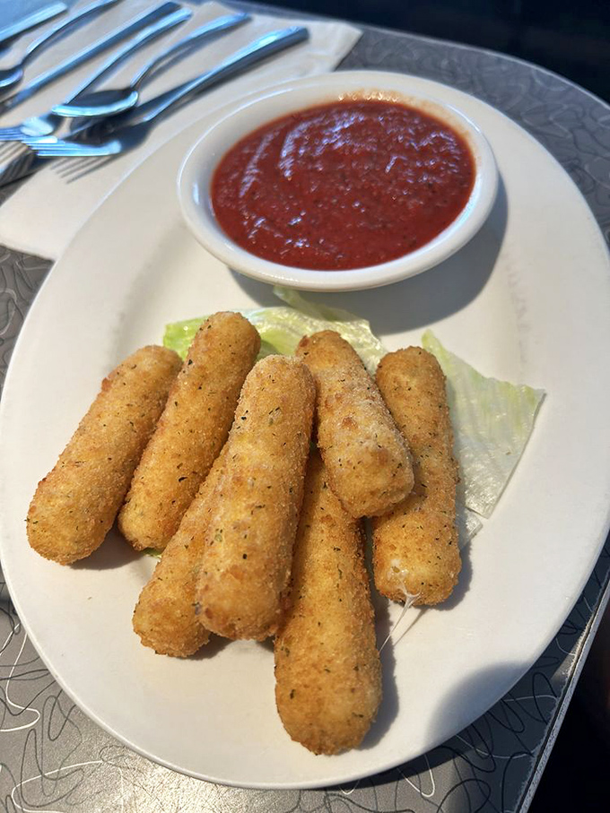 Mozzarella sticks &ndash; the appetizer that never graduated to adulthood, thank goodness. That marinara is dressed and ready for dipping action.