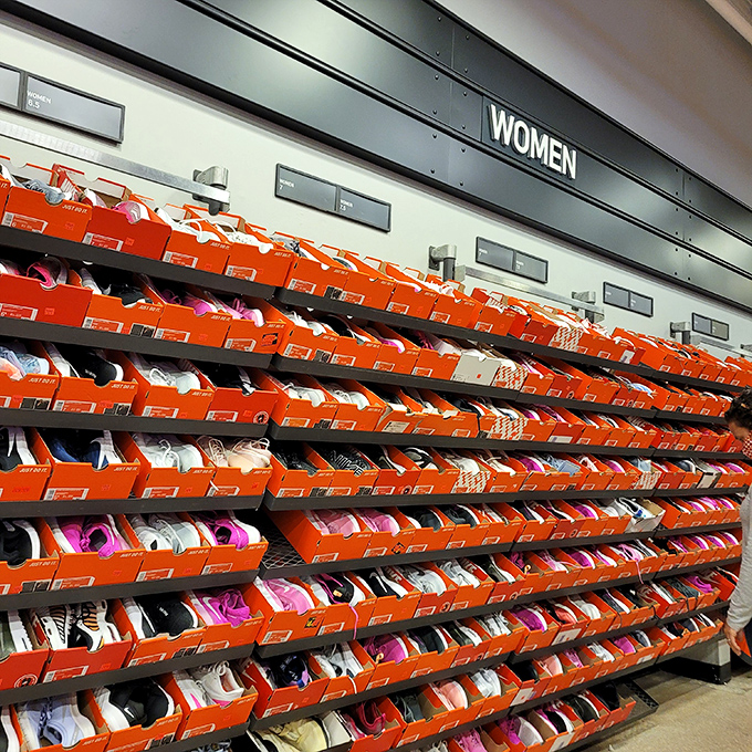 Wall-to-wall Nike boxes organized like a sneakerhead's fever dream, except everyone's invited to this particular exclusive party.