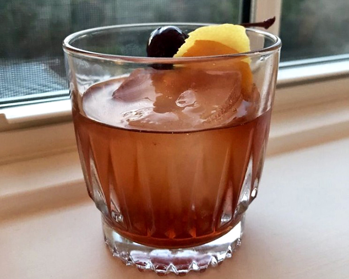 This Old Fashioned isn't just a cocktail; it's a time machine in a glass, garnished with nostalgia and a perfect cherry.