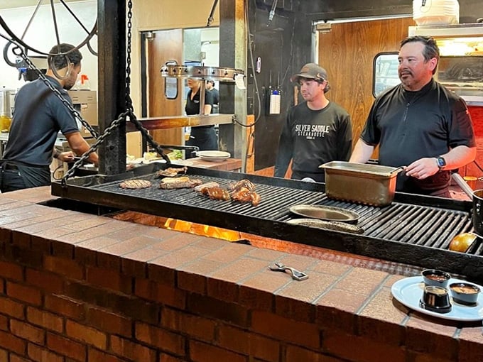 The open grill where culinary wizards work their flame-kissed magic on cuts of premium Arizona beef daily.