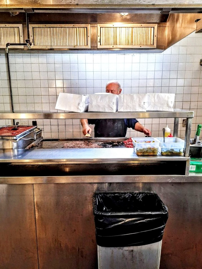 Behind the counter, sandwich artistry happens with practiced precision. Those wrapped packages aren't just lunch&mdash;they're edible treasures worth the pilgrimage.