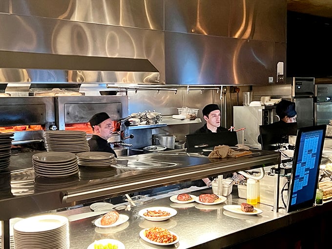 The open kitchen&mdash;where chefs perform the ancient ritual of fire meeting meat with the precision of concert pianists.