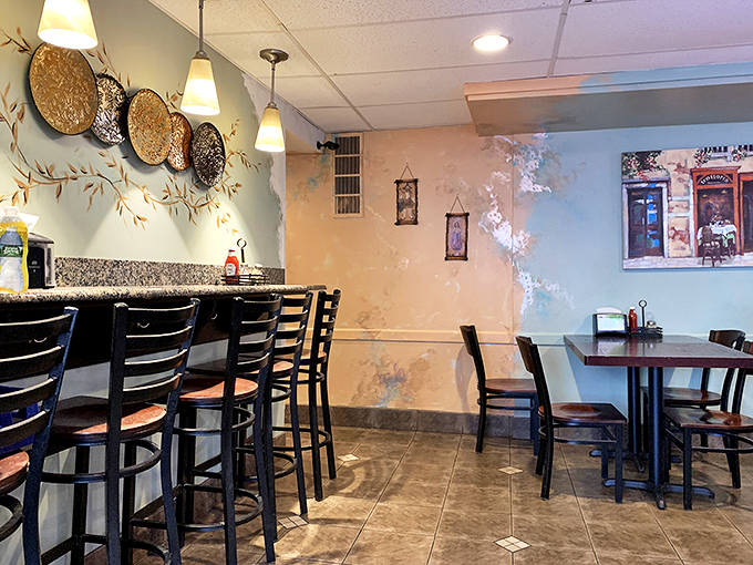 Bar seating with a view of painted landscapes &ndash; where solo diners become philosophers over pizza slices.