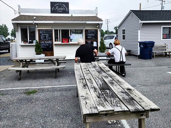 Simple wooden picnic tables offer respite for weary shoppers. The best negotiations happen after you've recharged with local treats.