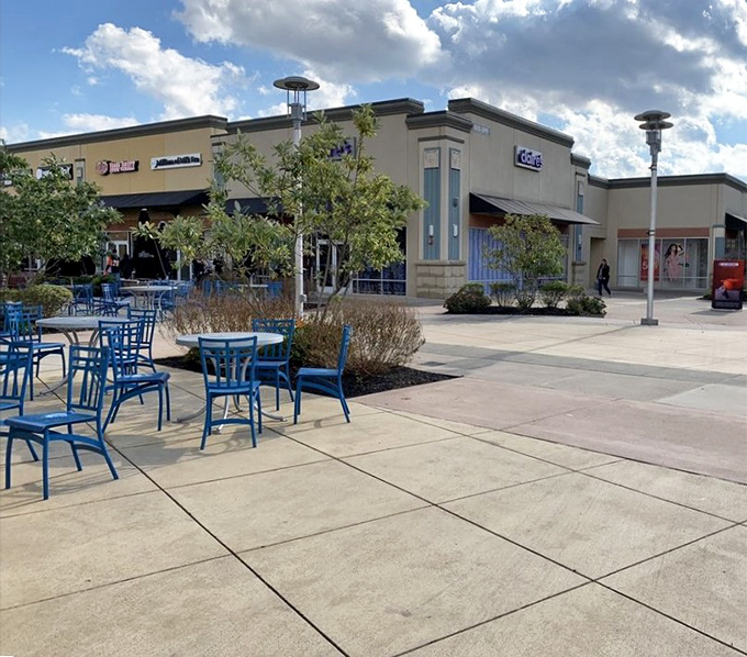 Outdoor seating areas provide perfect spots for regrouping, people-watching, and planning the next shopping assault.