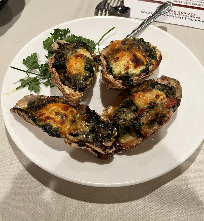Oysters Rockefeller looking positively regal in their shells, dressed up for a night out they won't soon forget.