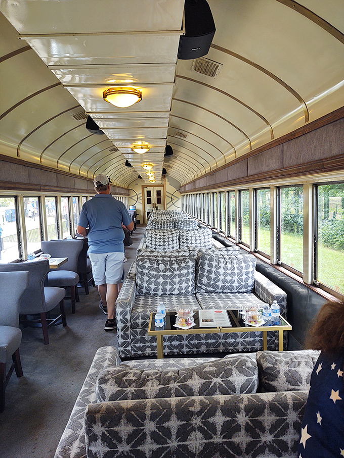 Plush seating arranged for conversation creates a rolling living room where strangers often become friends by journey's end.