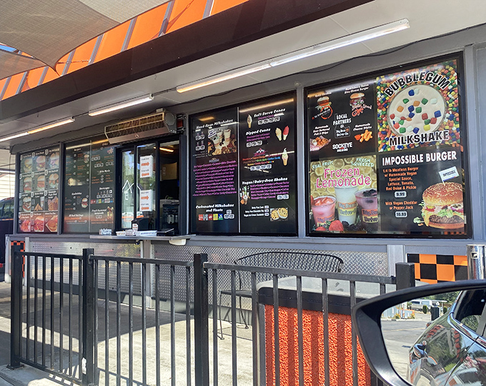 The pick-up window showcases an impressive array of milkshakes and specialty items. A stained-glass window for the church of comfort food.
