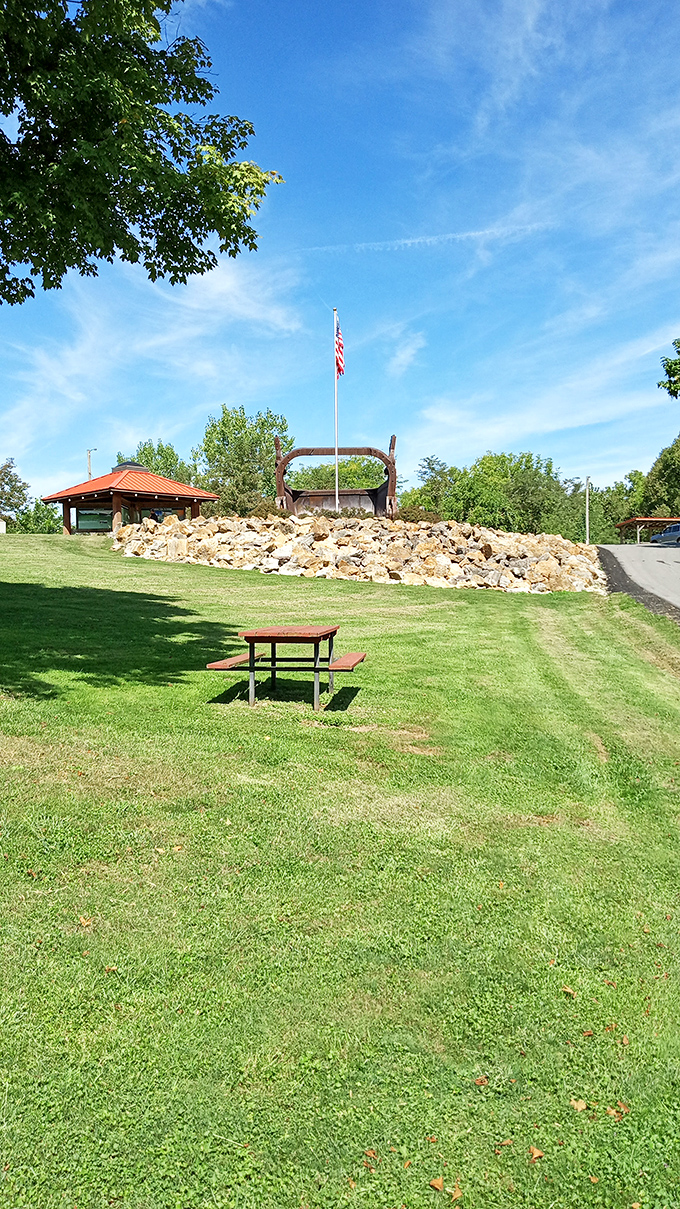 A peaceful picnic spot with an industrial twist—where else can you enjoy your sandwich in the shadow of a mechanical behemoth?