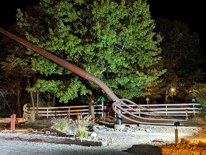 Nighttime illumination gives the pitchfork an almost otherworldly presence, as if Neptune himself might reclaim it at any moment.