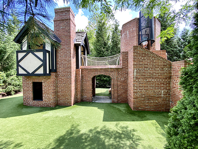 The estate's playhouse is nicer than most people's actual houses, teaching children early that real estate expectations should be completely unrealistic.