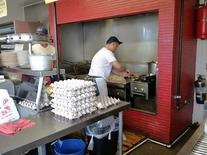 Behind the scenes where the magic happens. Those stacks of eggs aren't going to scramble themselves into breakfast burrito perfection.