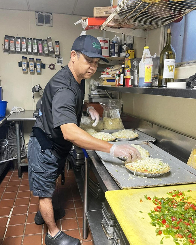 Behind-the-scenes kitchen magic where skilled hands transform simple ingredients into breakfast poetry on every plate.