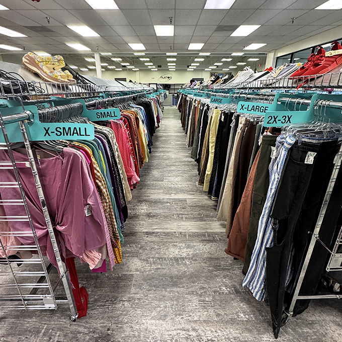The view down fashion avenue. Racks organized by size create shopping lanes that would make any department store jealous of this thrift efficiency.