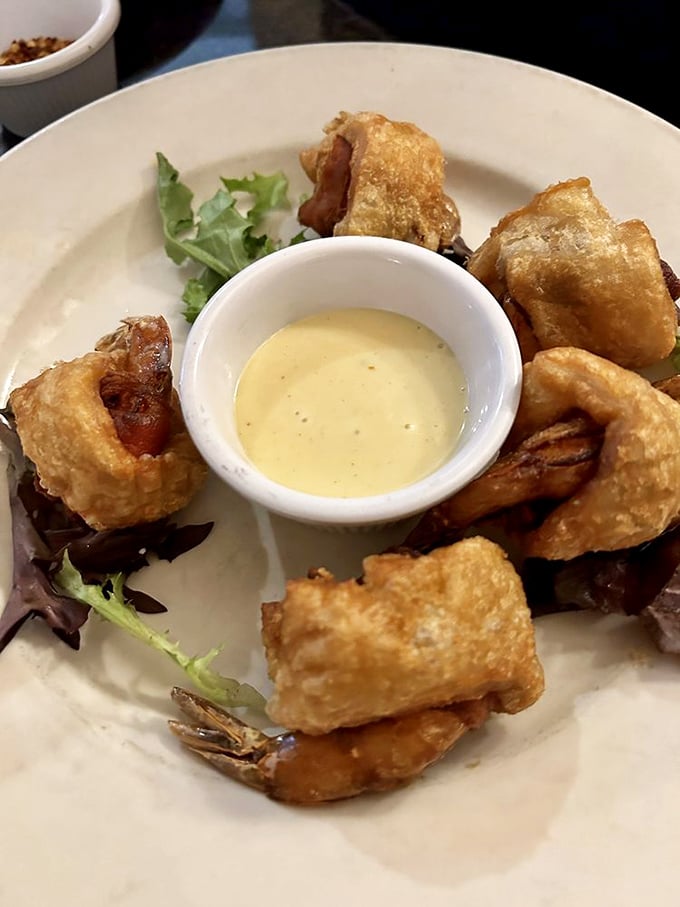 Puffed shrimp wrapped in golden jackets, surrounding a dipping sauce that's begging to play matchmaker between seafood and your taste buds.
