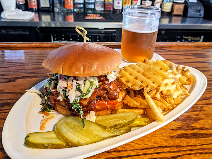This pulled pork sandwich isn't just food &ndash; it's an edible hug on a brioche bun, complete with the kind of slaw that makes vegetables worth eating.