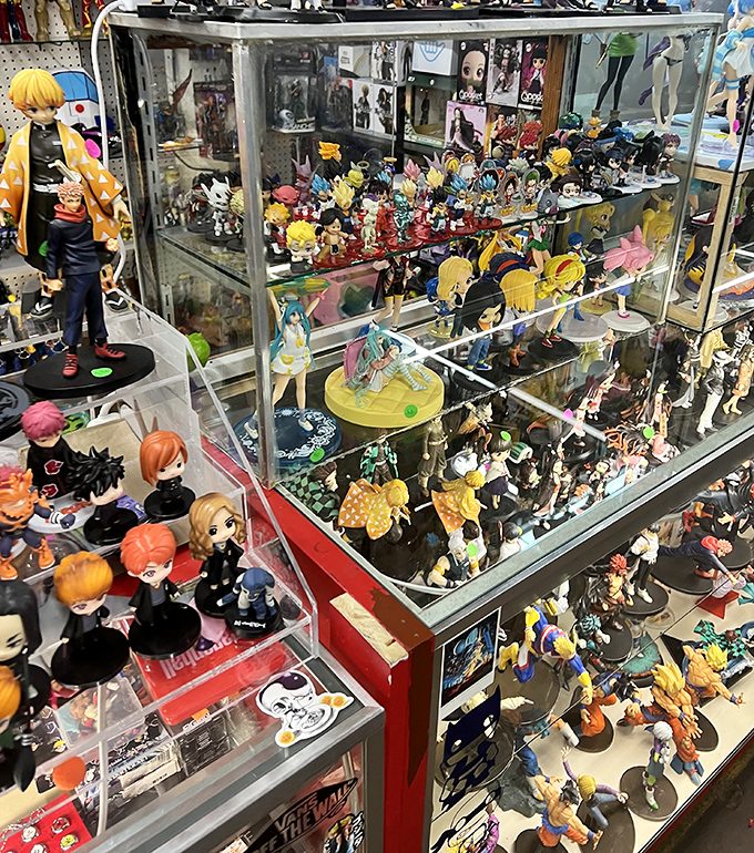 Anime figurine nirvana, where collectors speak in reverent tones about limited editions. The glass case serves as both display and protection from impulse purchases.