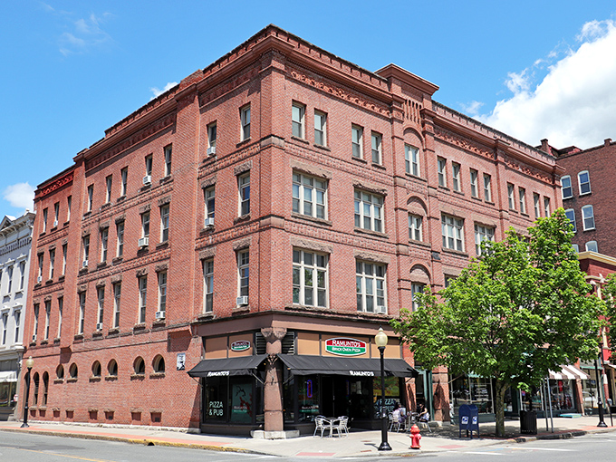 This corner brick building has witnessed North Adams' every transformation, now housing eateries where factory workers once hurried past.