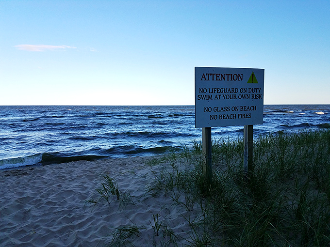 The sign that reminds you you're truly on vacation. "No lifeguard" means you're responsible for your own adventure—just how the locals like it.