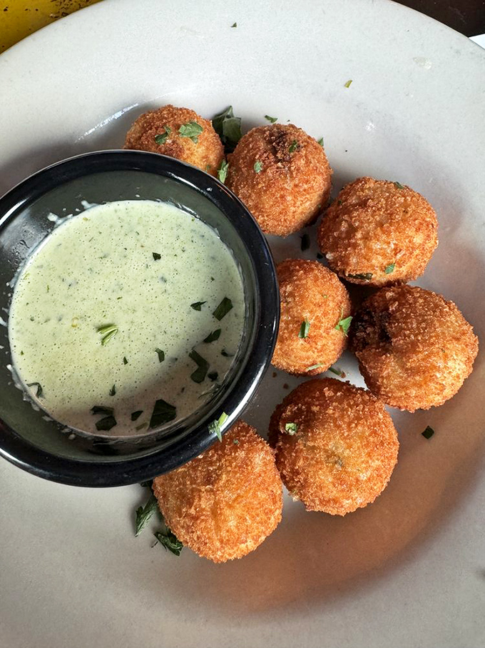 These golden risotto bites are what happens when Italian comfort food decides to dress up and go to a fancy cocktail party.