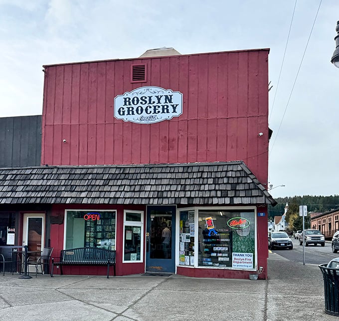 Roslyn Grocery's vibrant red exterior stands out like a cheerful neighbor, offering essentials with small-town warmth rather than big-box anonymity.