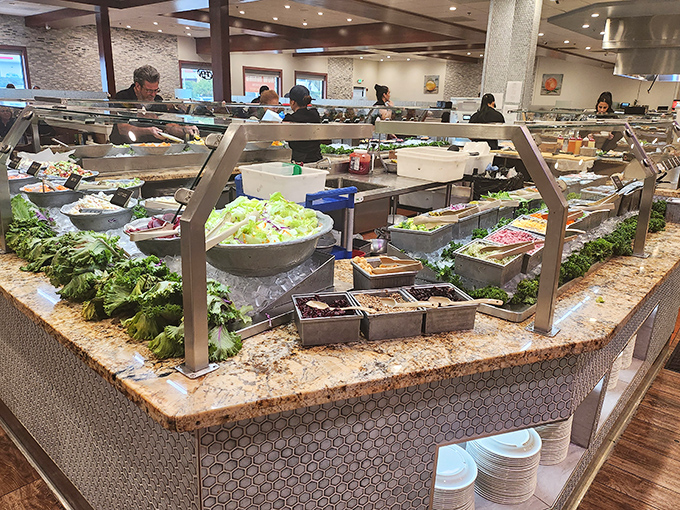 Fresh ingredients awaiting their transformation. This salad bar puts your sad office cafeteria's wilted lettuce selection to absolute shame.