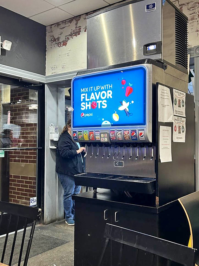 The self-service drink station offers liquid companionship for your pizza adventure. Choose wisely&mdash;the right beverage pairing elevates the cold-cheese experience to new heights.