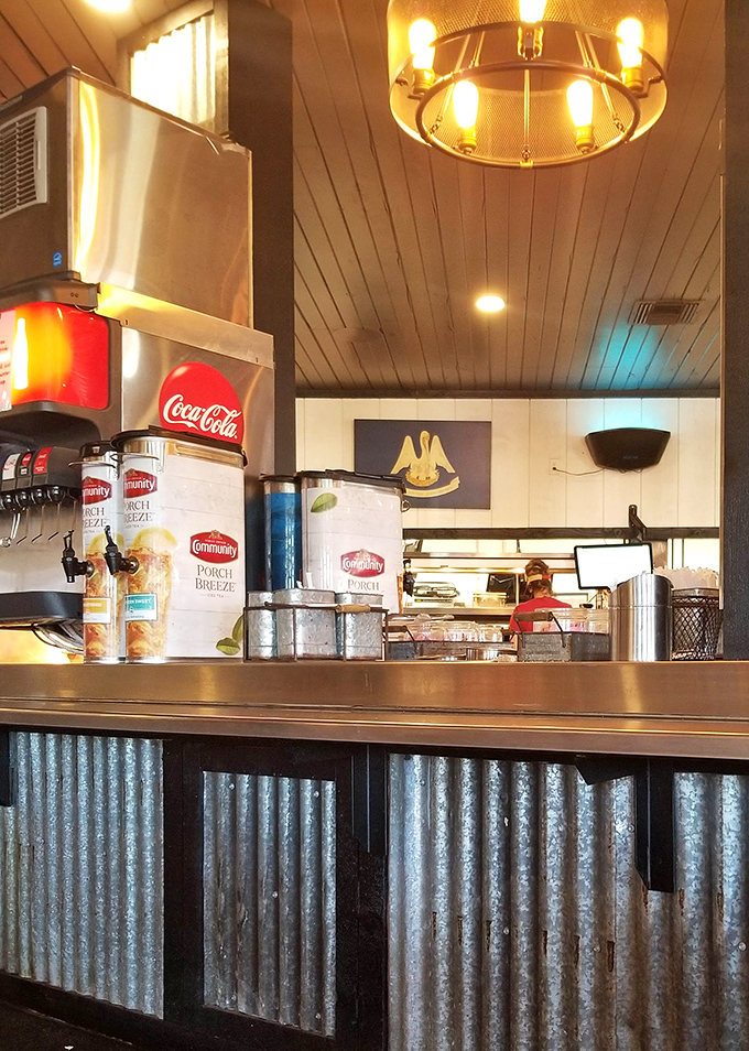 Behind every great barbecue joint is a counter where magic happens, with Louisiana's state flag proudly watching over the proceedings.